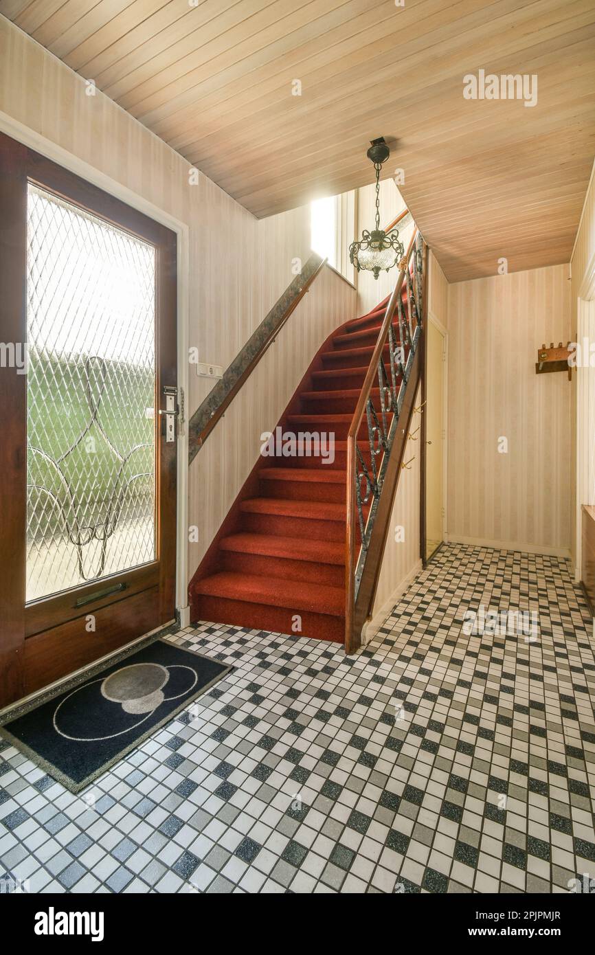 a room with stairs and tiled floor in the middle part of the room is an ...