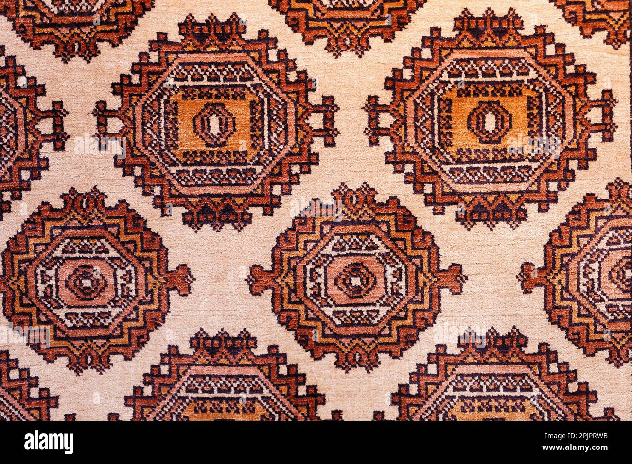 Colorful handmade silk carpet with pattern in red tones, traditional ...