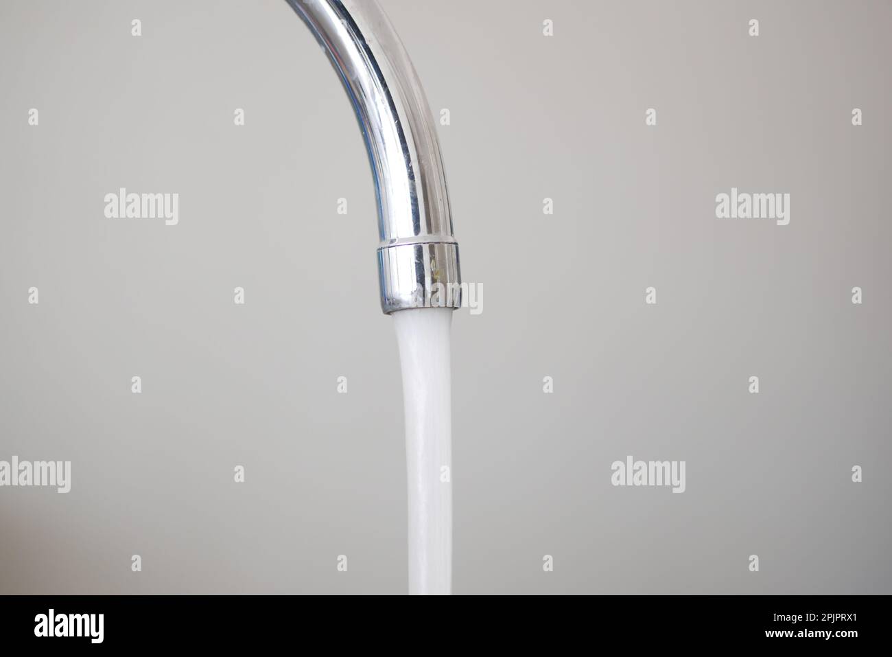 water pouring from a faucet tap slow motion Stock Photo - Alamy