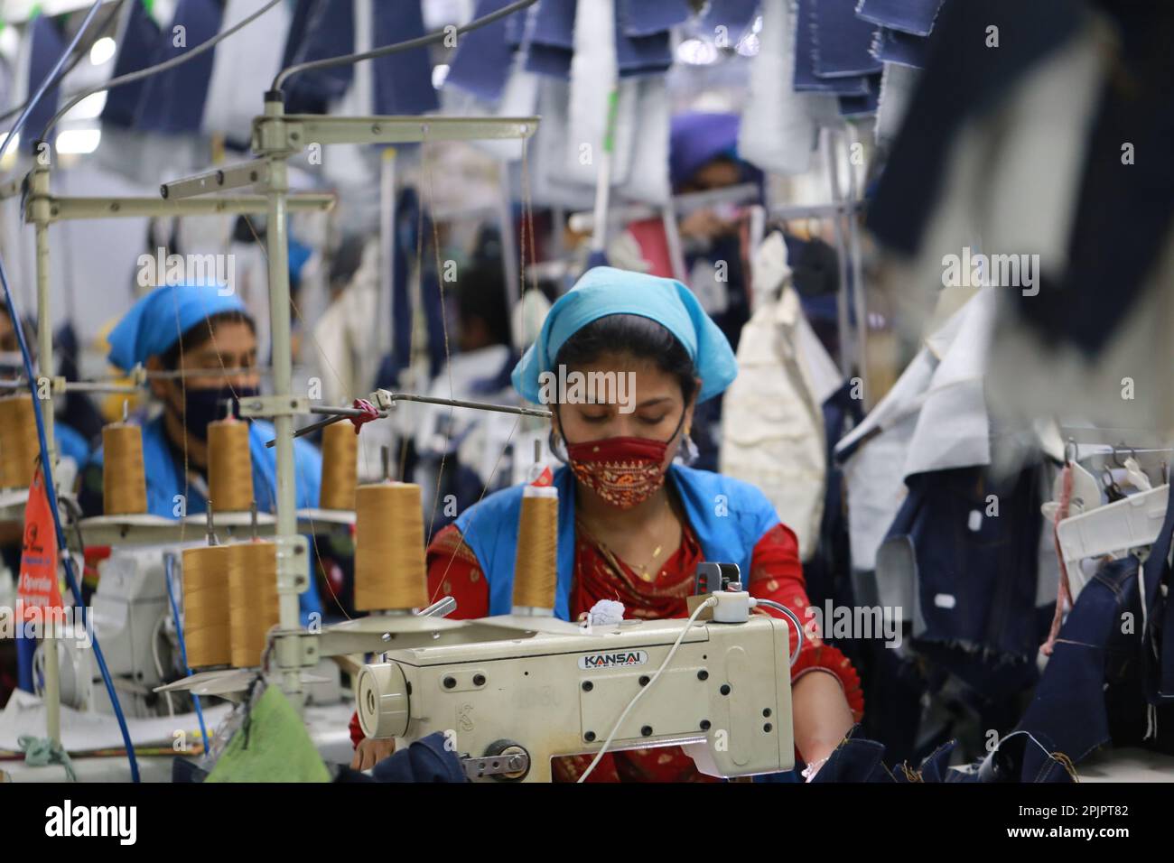 Garment workers work at a ready-made garment factory in Bangladesh ...