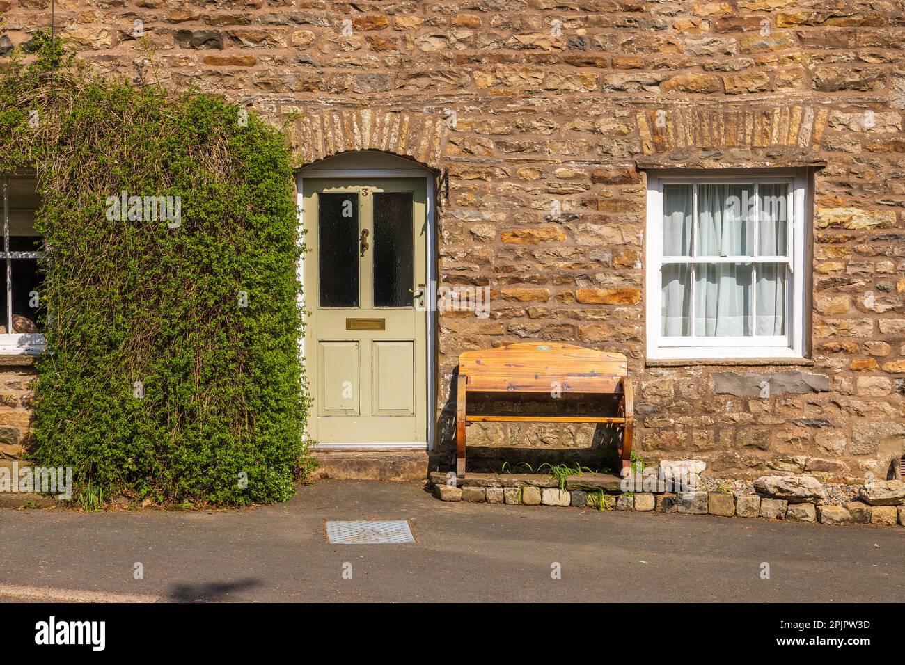 View of the buildings of the Sedbergh village. Beautiful garden. Sunny ...