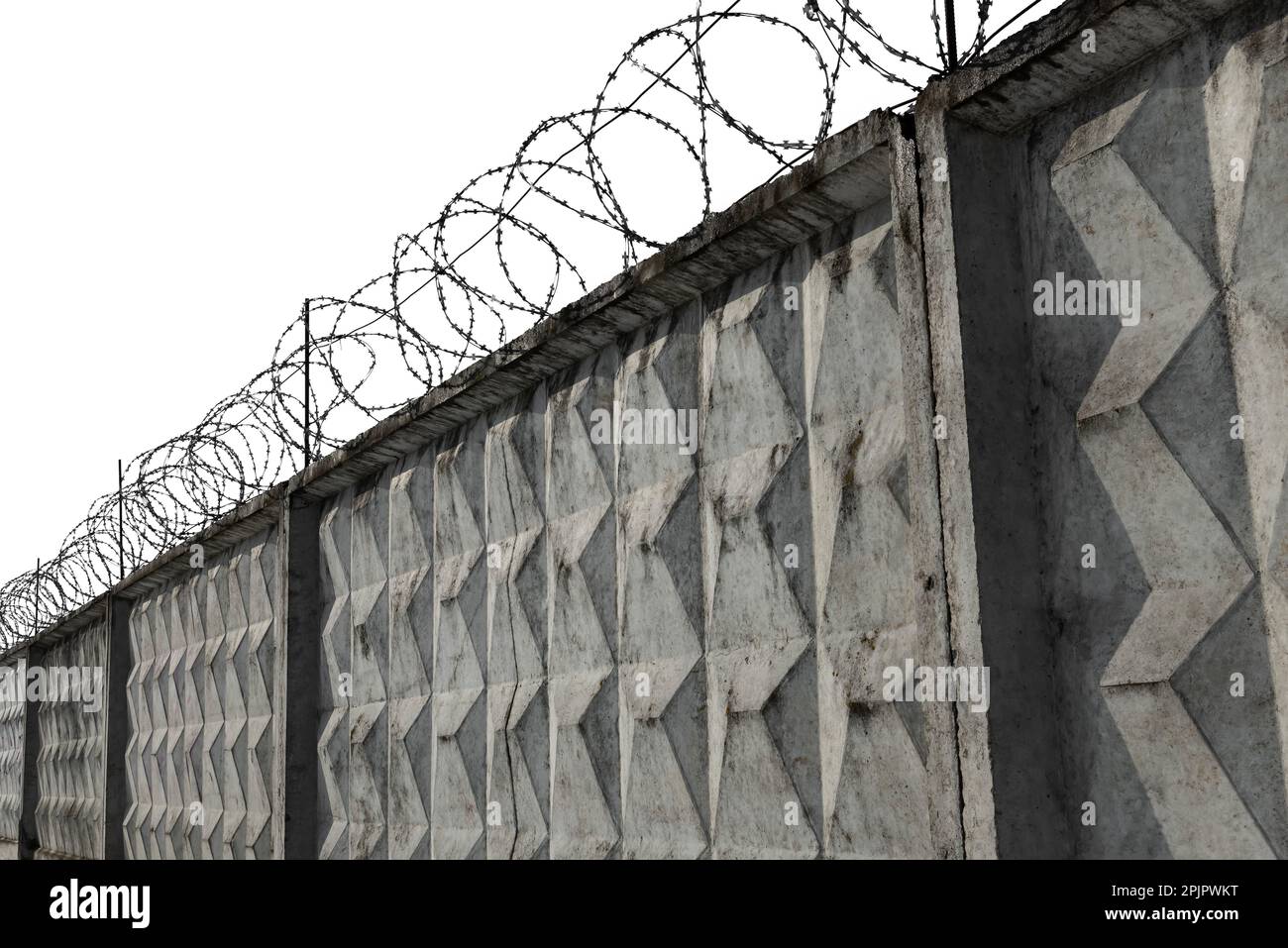 Jail. Prison wall with barbed wire on a white background. Law Stock ...
