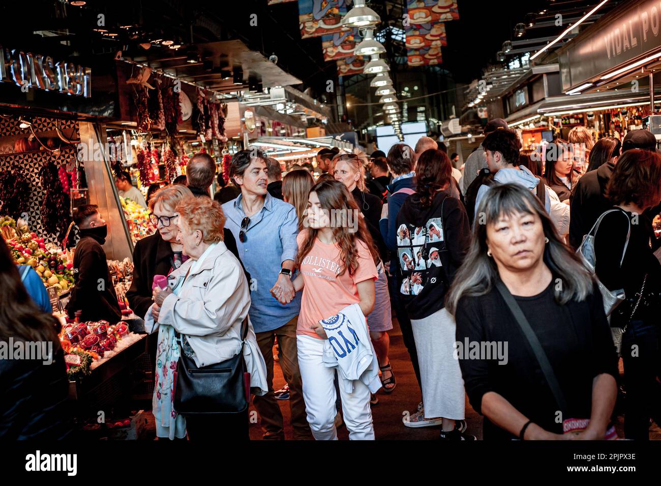 Visitors walk La Boqueria market in Barcelona. During this Holy Week ...