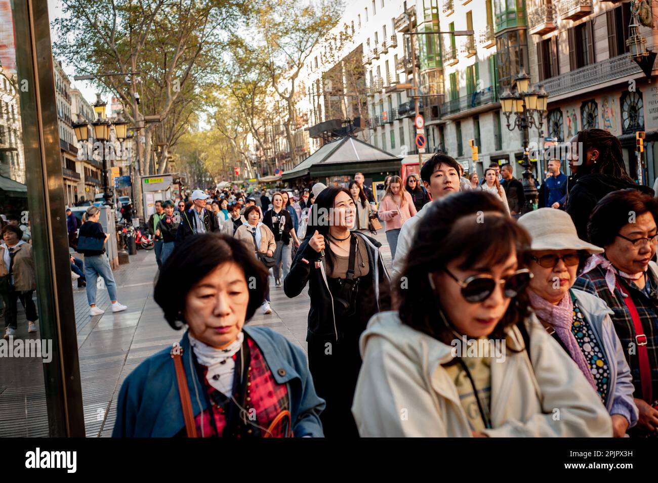 Tourists walk down La Rambla in Barcelona. During this Holy Week, Spain ...