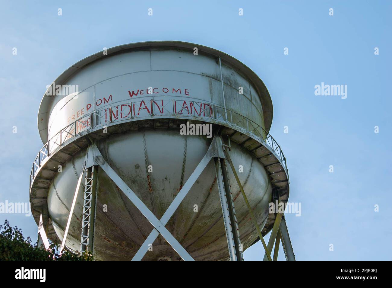 Photograph of the famous Alcatraz water tower with graffiti following ...
