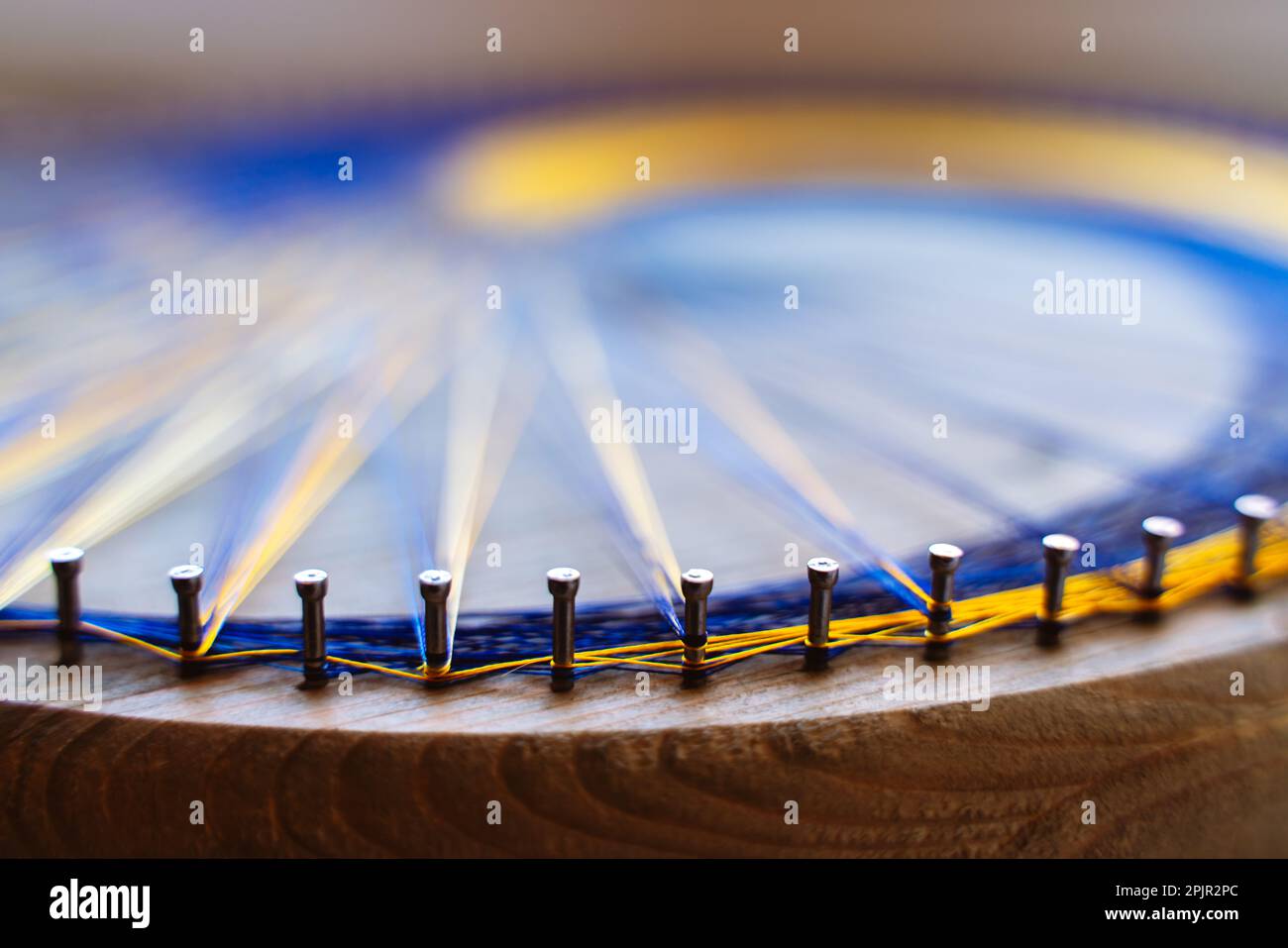 Colored thread mandala on a wooden board with nails. Mandala Moon ...