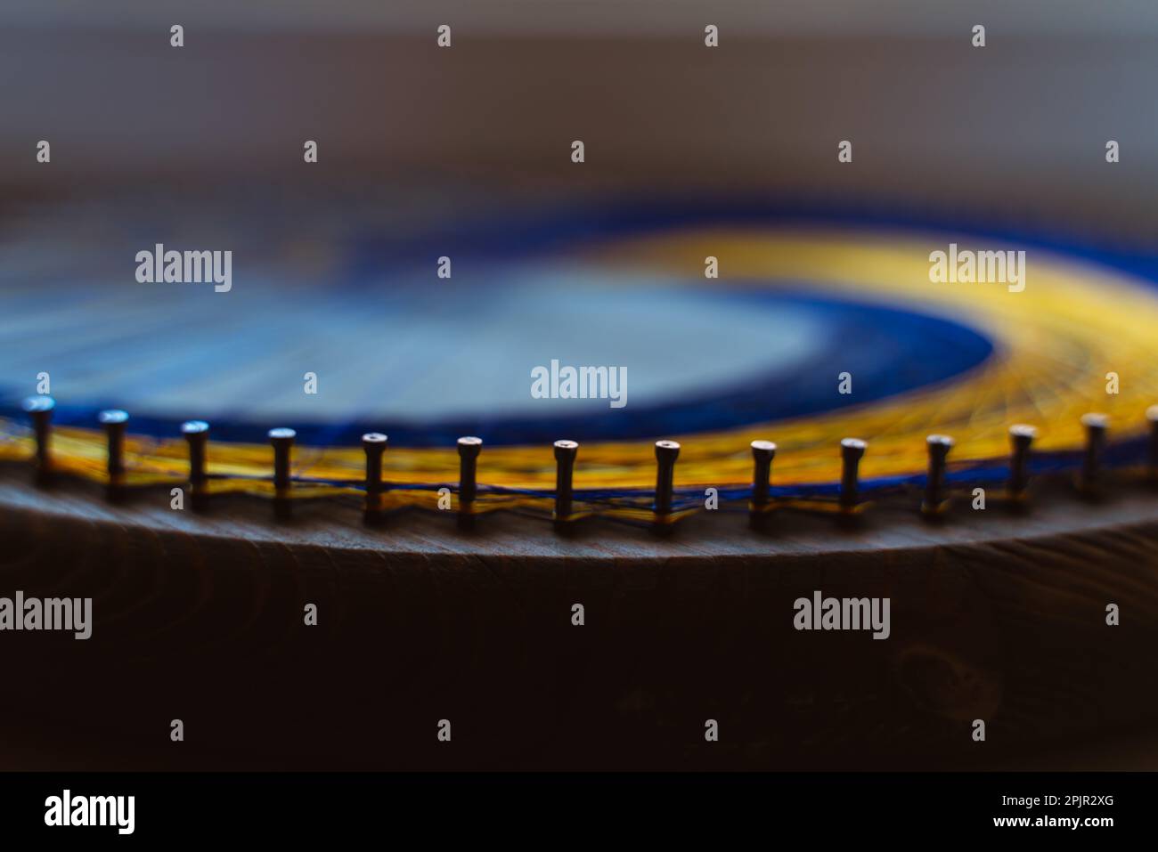 Colored thread mandala on a wooden board with nails. Mandala Moon ...