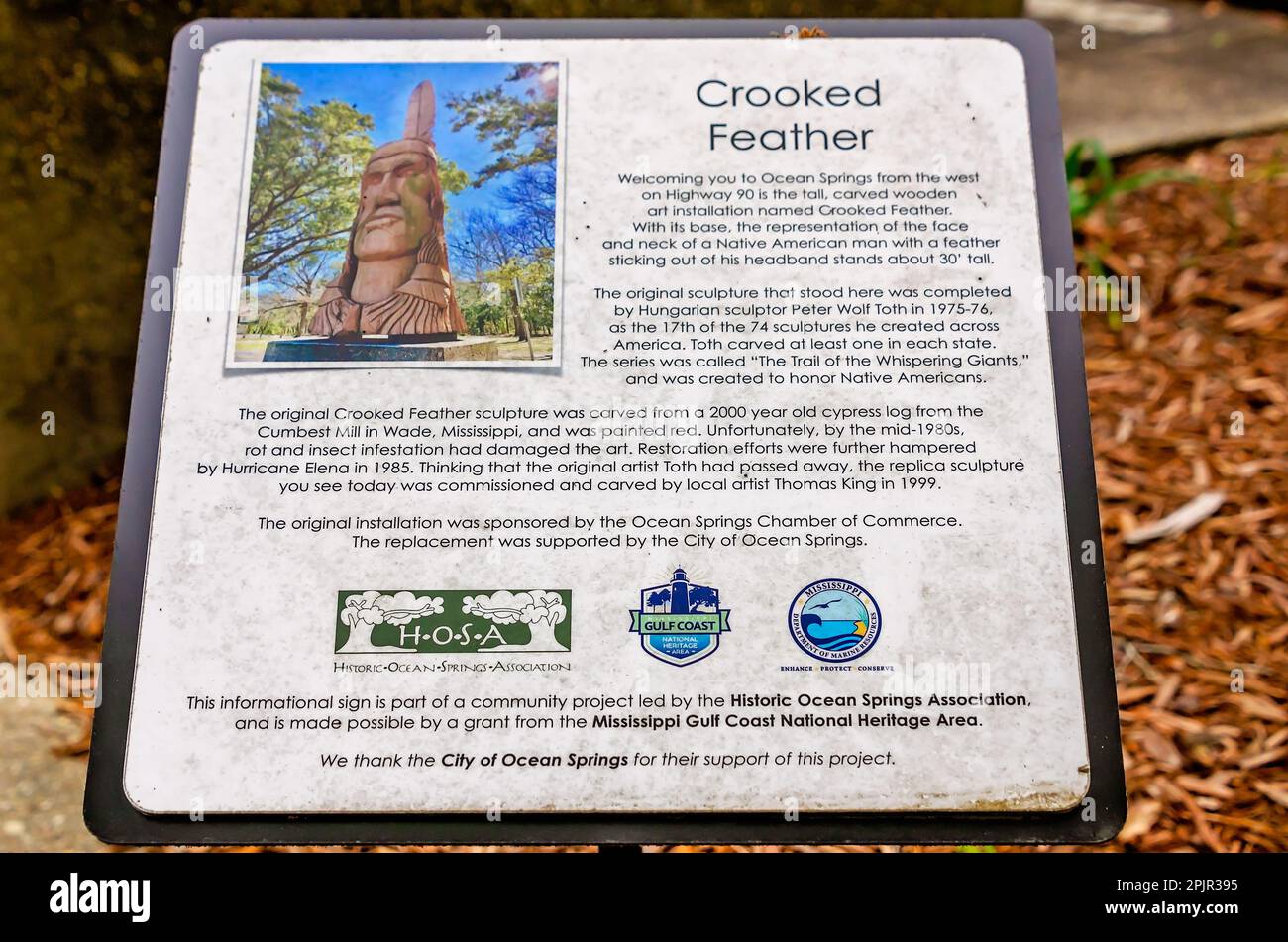 a sign tells the history of Crooked Feather, a 30-foot Indian sculpture ...