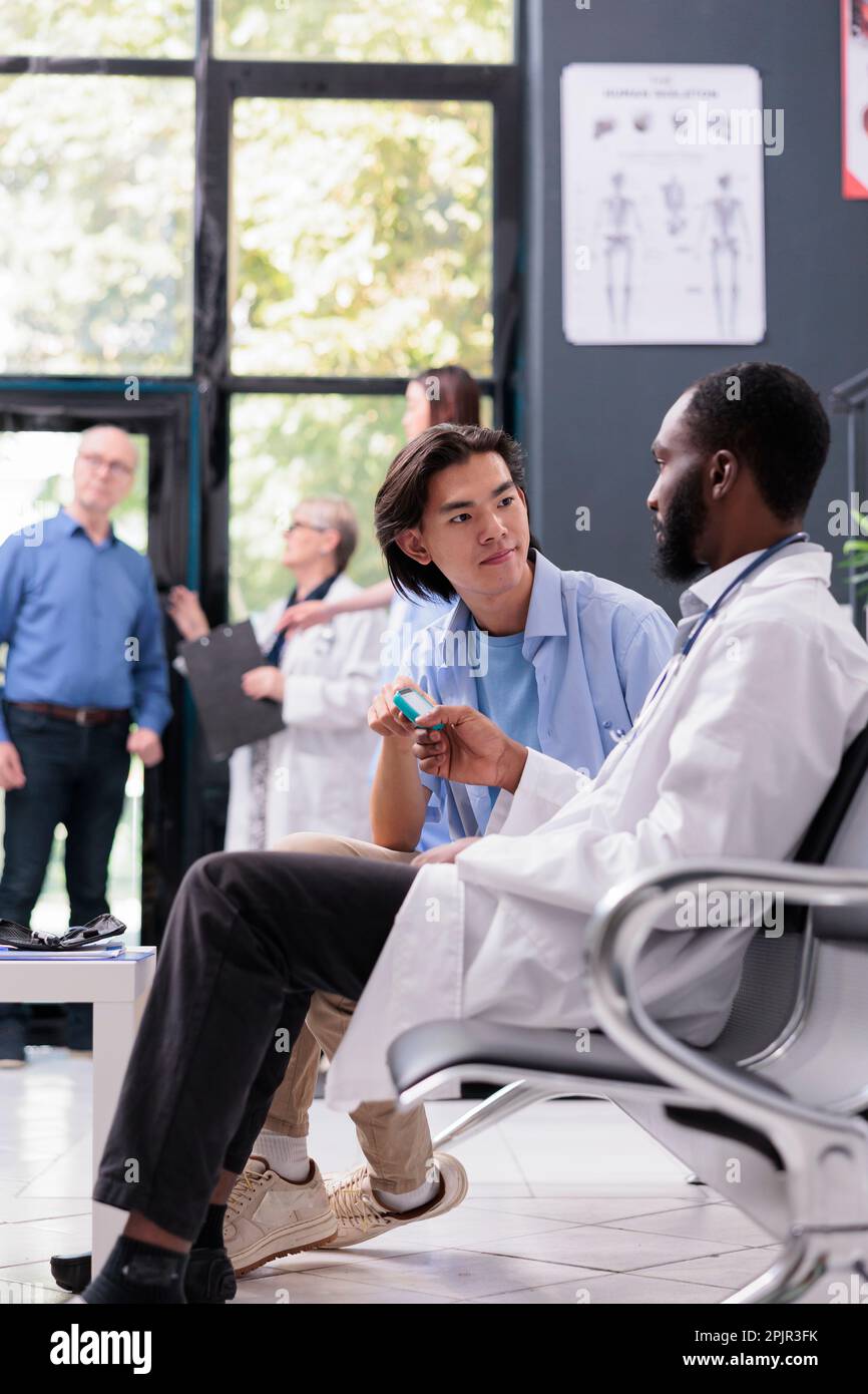 Physician doctor measuring insulin level and glucose in blood sample ...