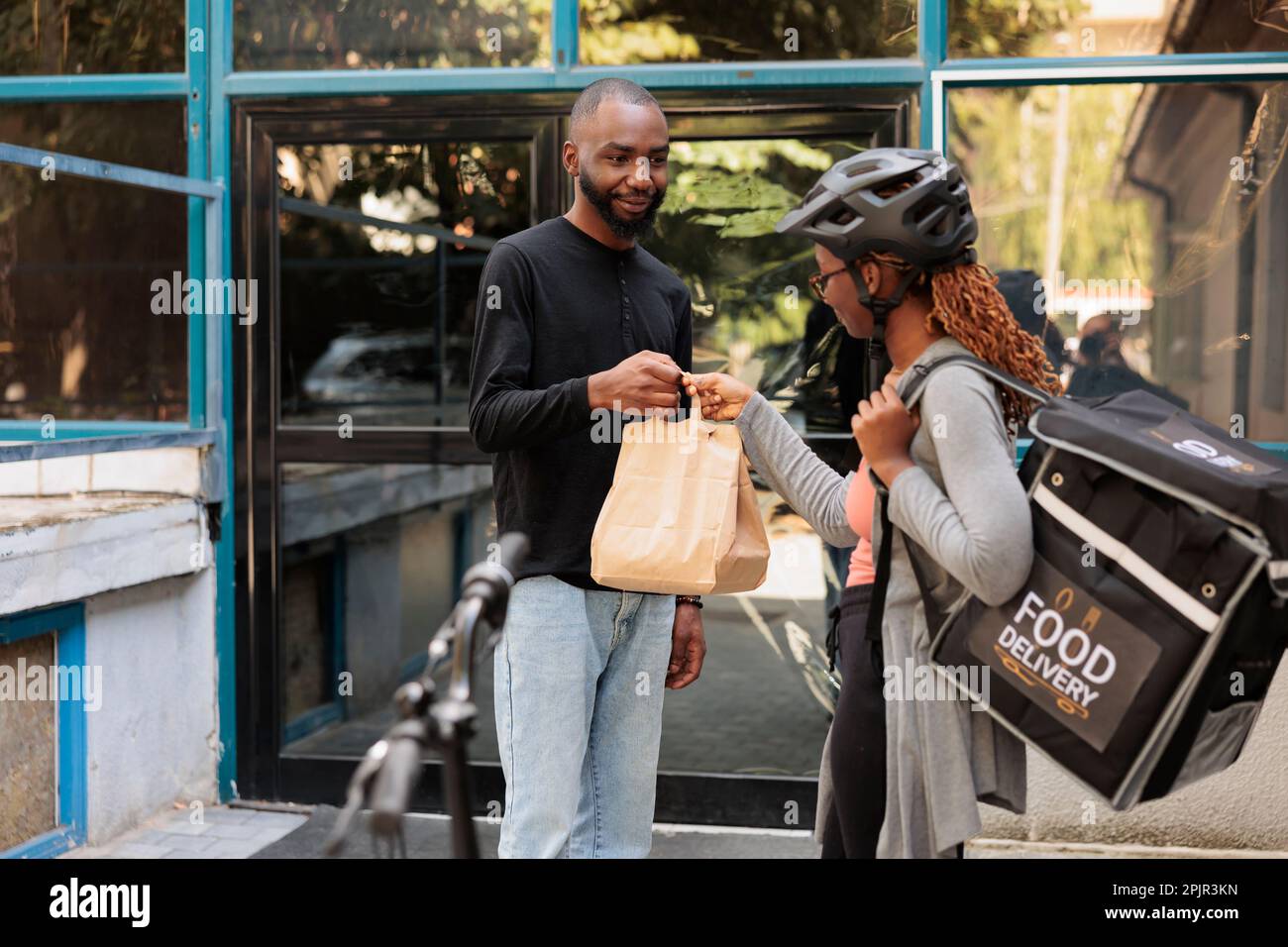 Fast food delivery service, courier giving client order paper bag ...