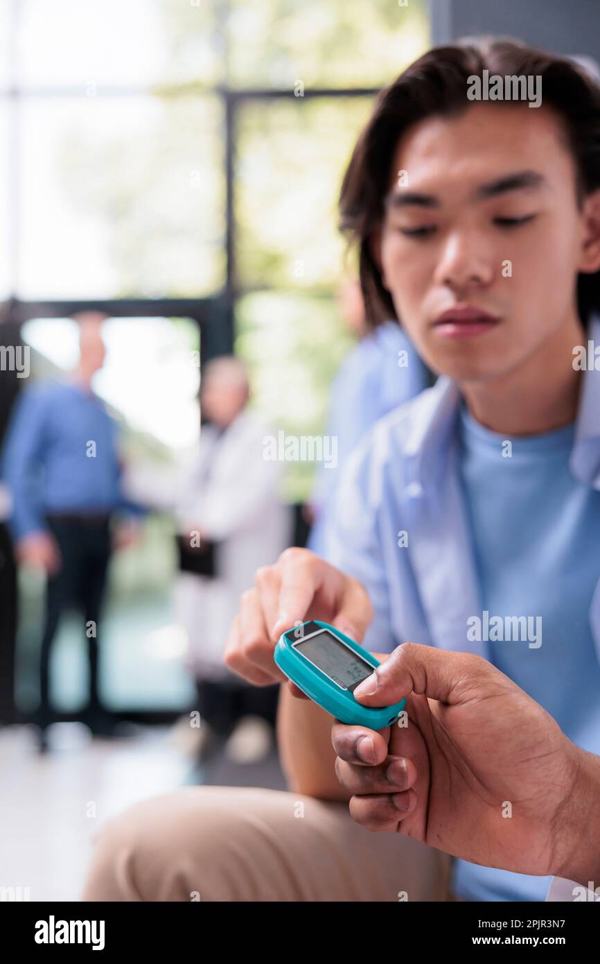 Close up of doctor doing patient hypertension examination using ...