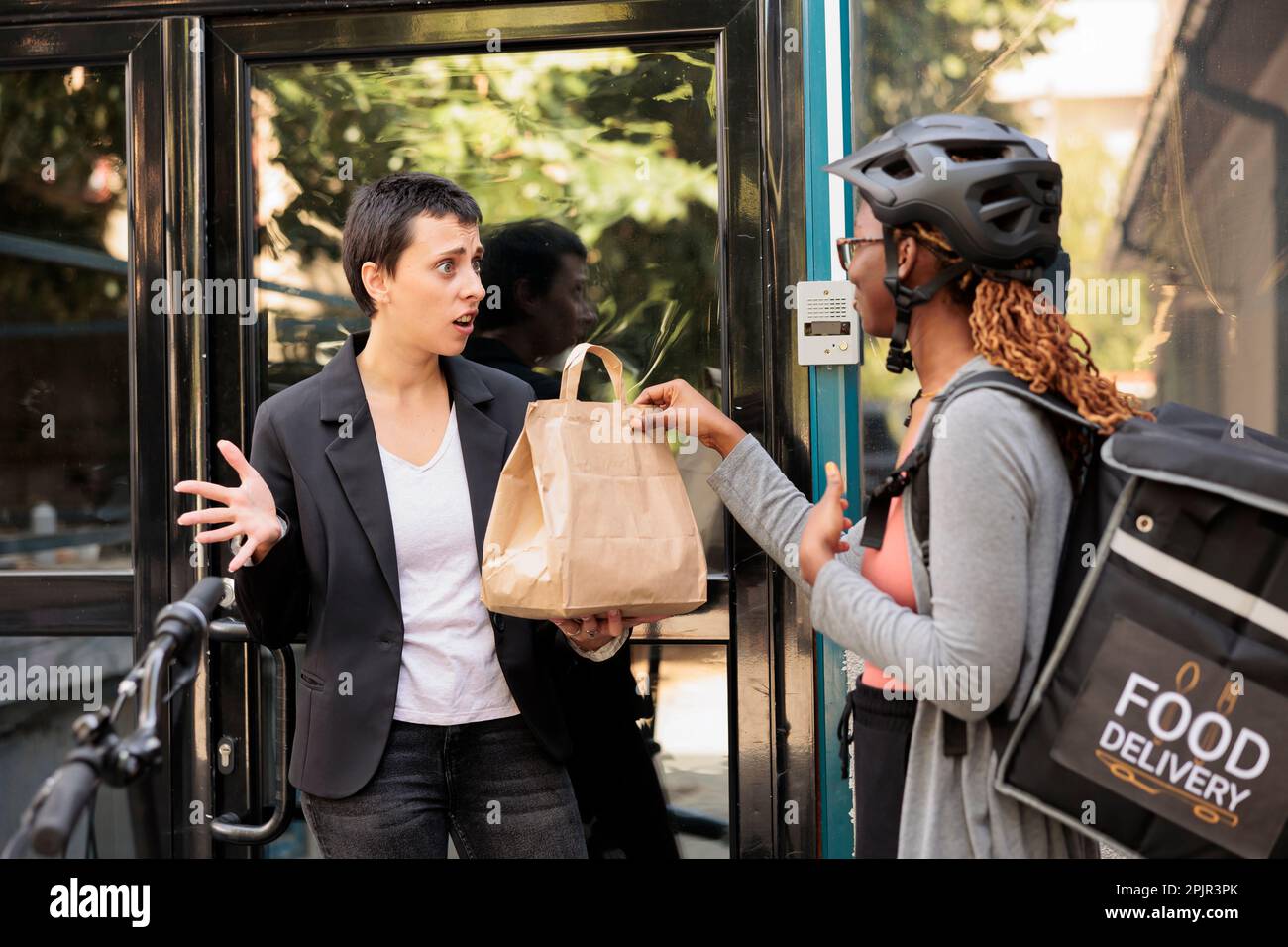 Angry client shouting at office food delivery service courier, customer ...