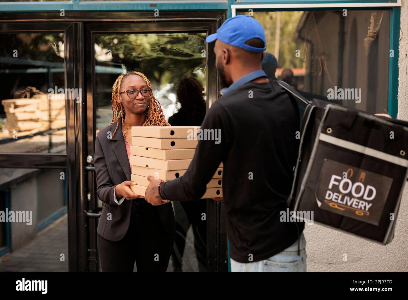 Food delivery to office, cheerful client holding pizza boxes pile ...