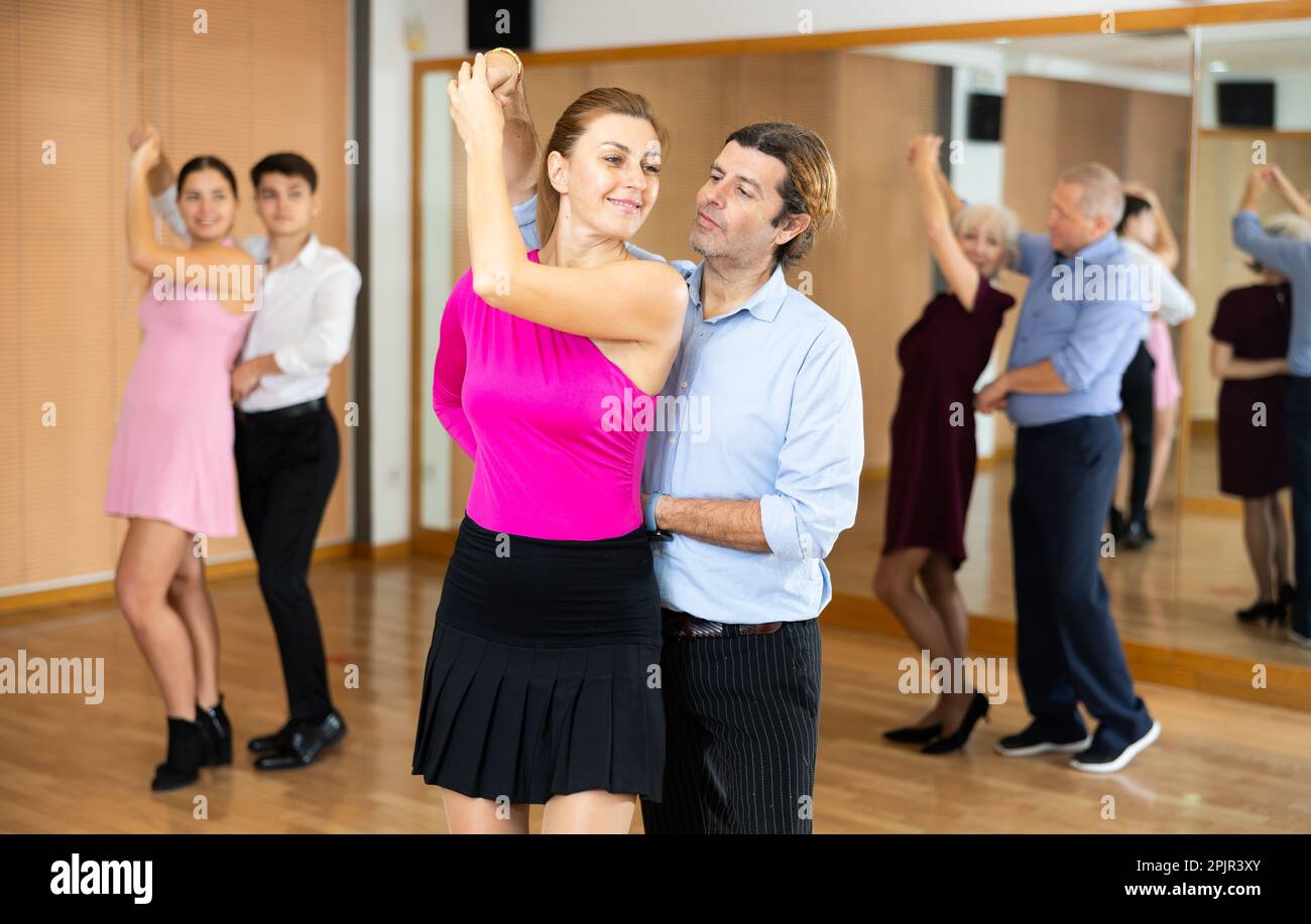 Couple of dancers rehearsing ballroom dances in dance studio Stock Photo - Alamy