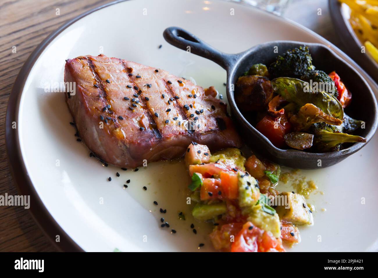 Braised tuna fillet with vegetables Stock Photo - Alamy