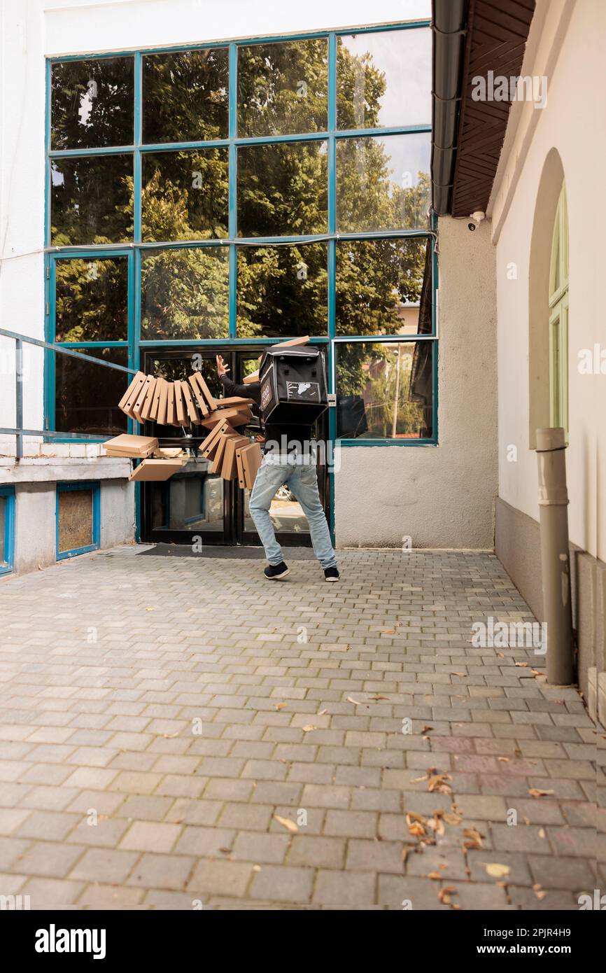 Delivery man falling stack boxes hi-res stock photography and images ...