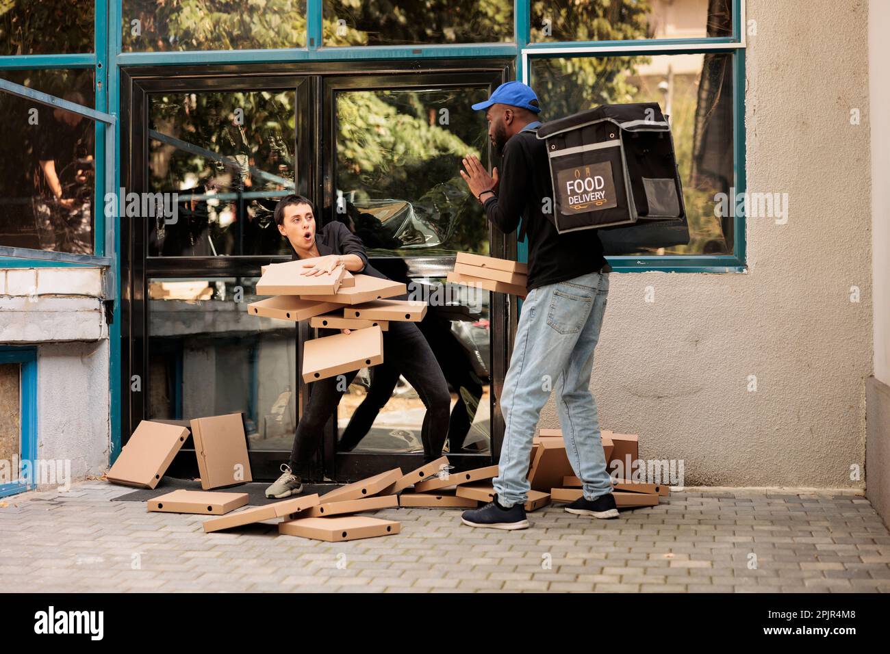 Delivery man falling stack boxes hi-res stock photography and images ...