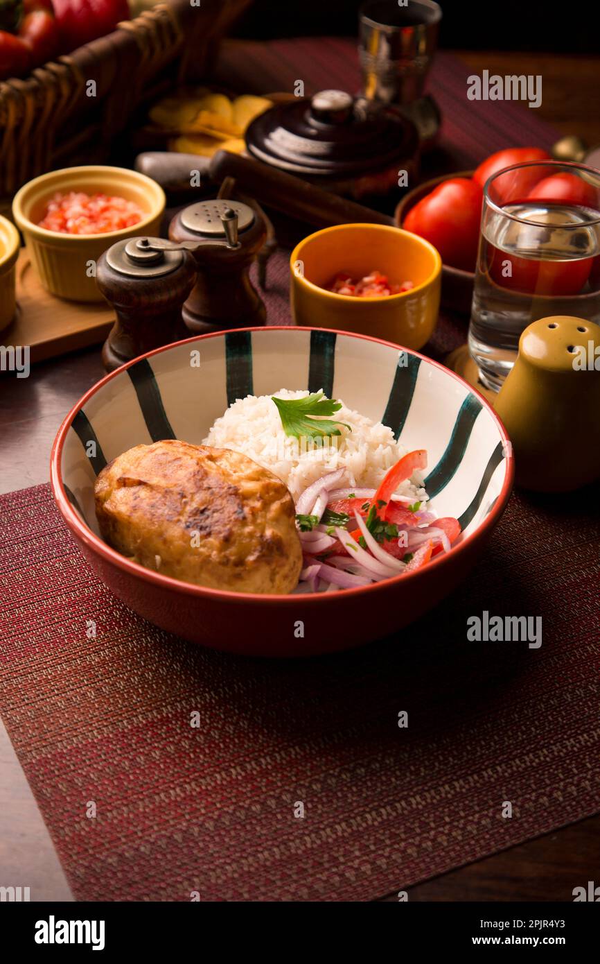 Papa rellena stuffed potato Peruvian food buffet table Assorted dishes ...