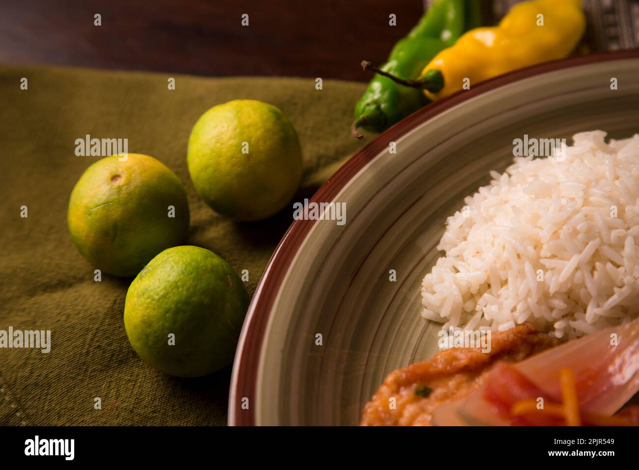 Green small lemons Peruvian food buffet table Assorted dishes gourmet ...