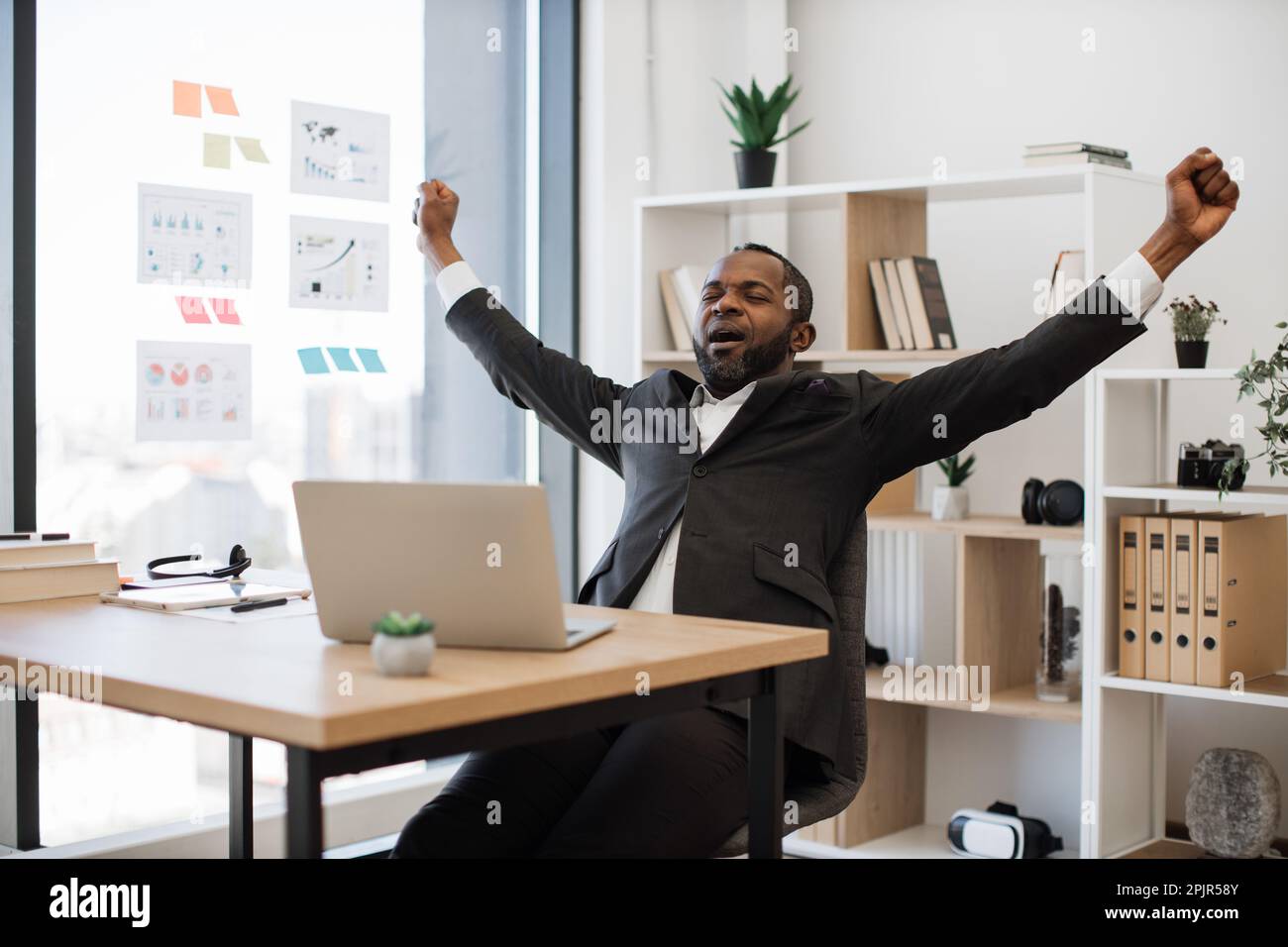 Sleepy and tired african american man in formal wear yawning and ...