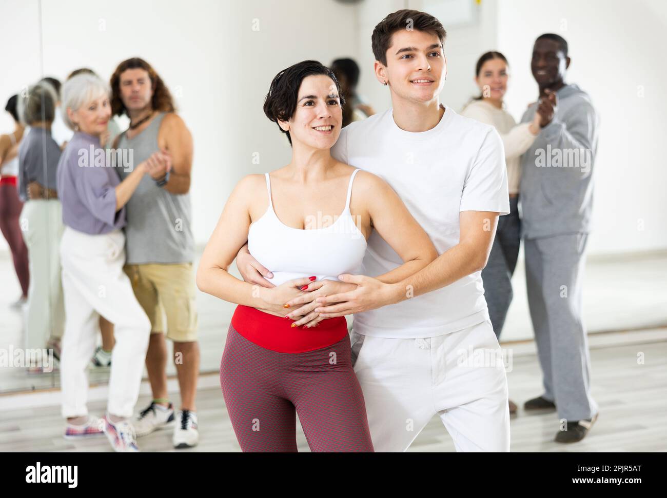 Adult couple of dancers learns partner dance Stock Photo - Alamy