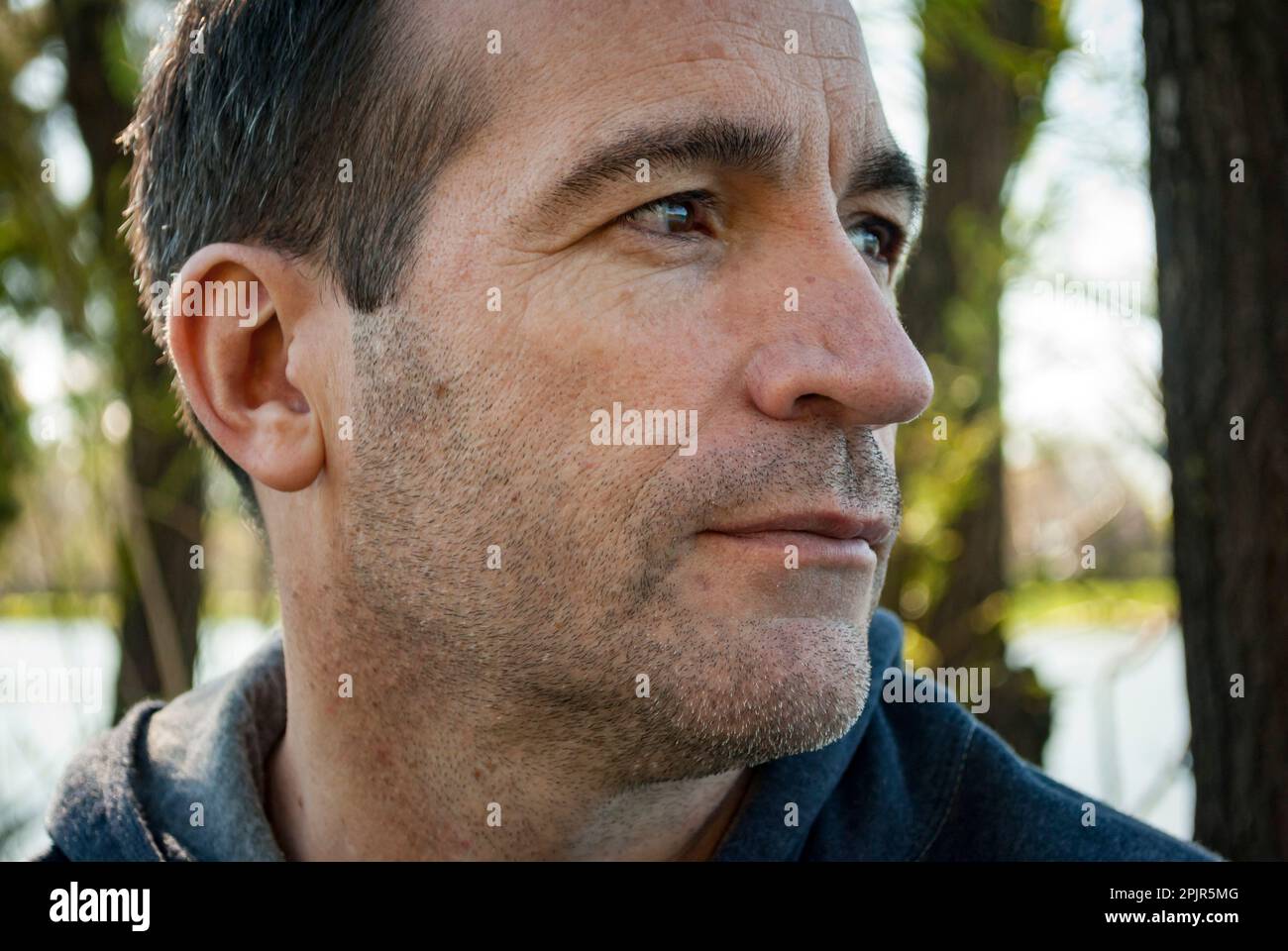 Close up of the face of a good looking man. Side view Stock Photo - Alamy