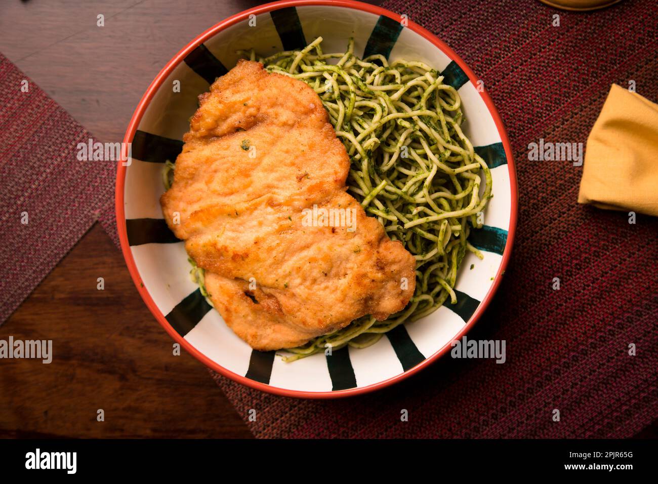 Green pasta with fried chicken Peruvian food buffet table Assorted ...