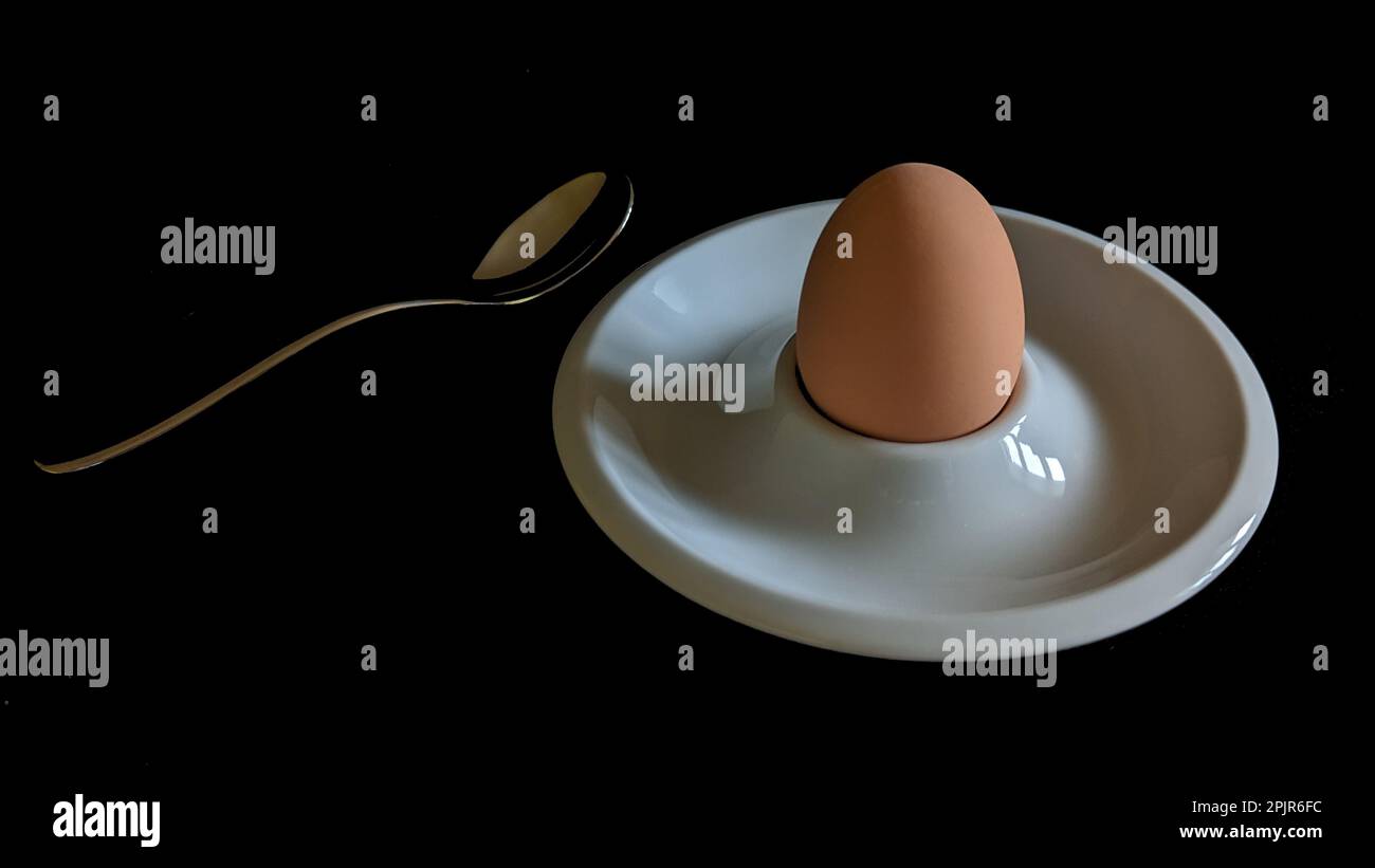 Egg, egg cup and spoon Stock Photo - Alamy