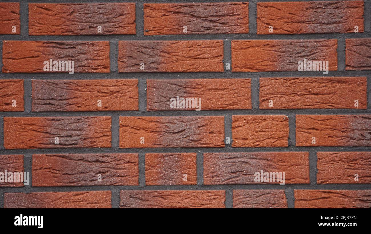 A high resolution closeup image of a textured brick wall with an aged ...