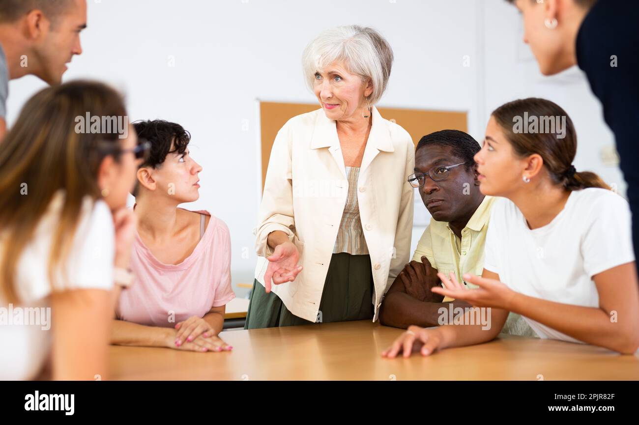 Group of people attending language course Stock Photo - Alamy