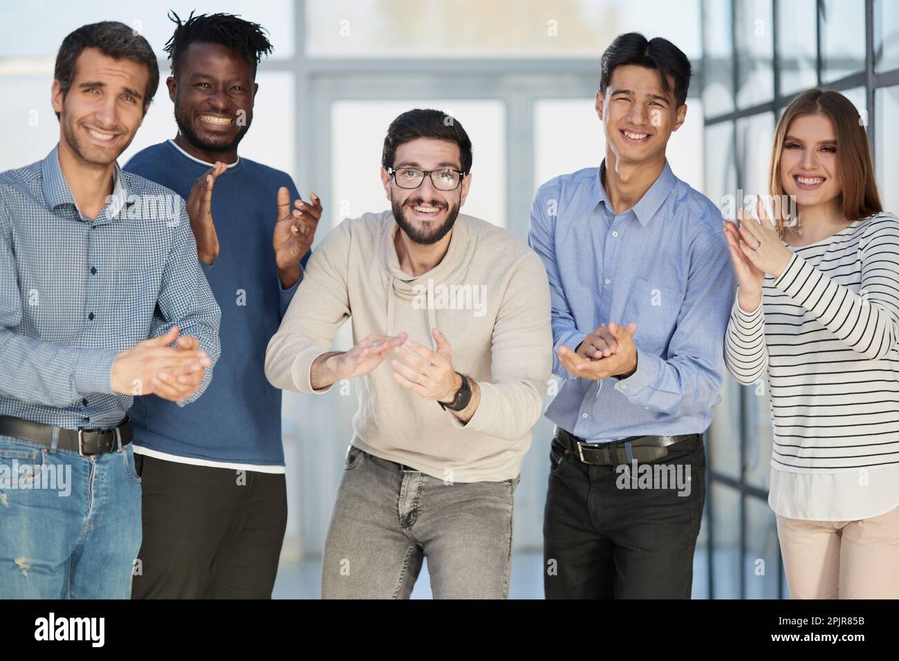 Successful business group applauding at the office Stock Photo - Alamy