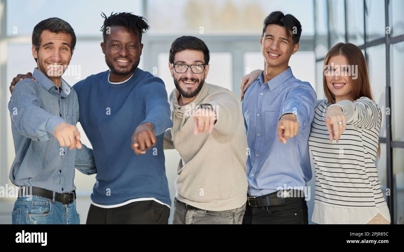young people show forward while standing in the lobby of the office ...