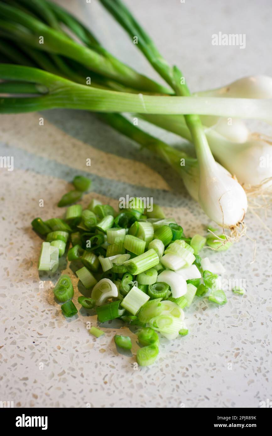 Chopped fresh green onions ready to cook peruvian food Stock Photo - Alamy