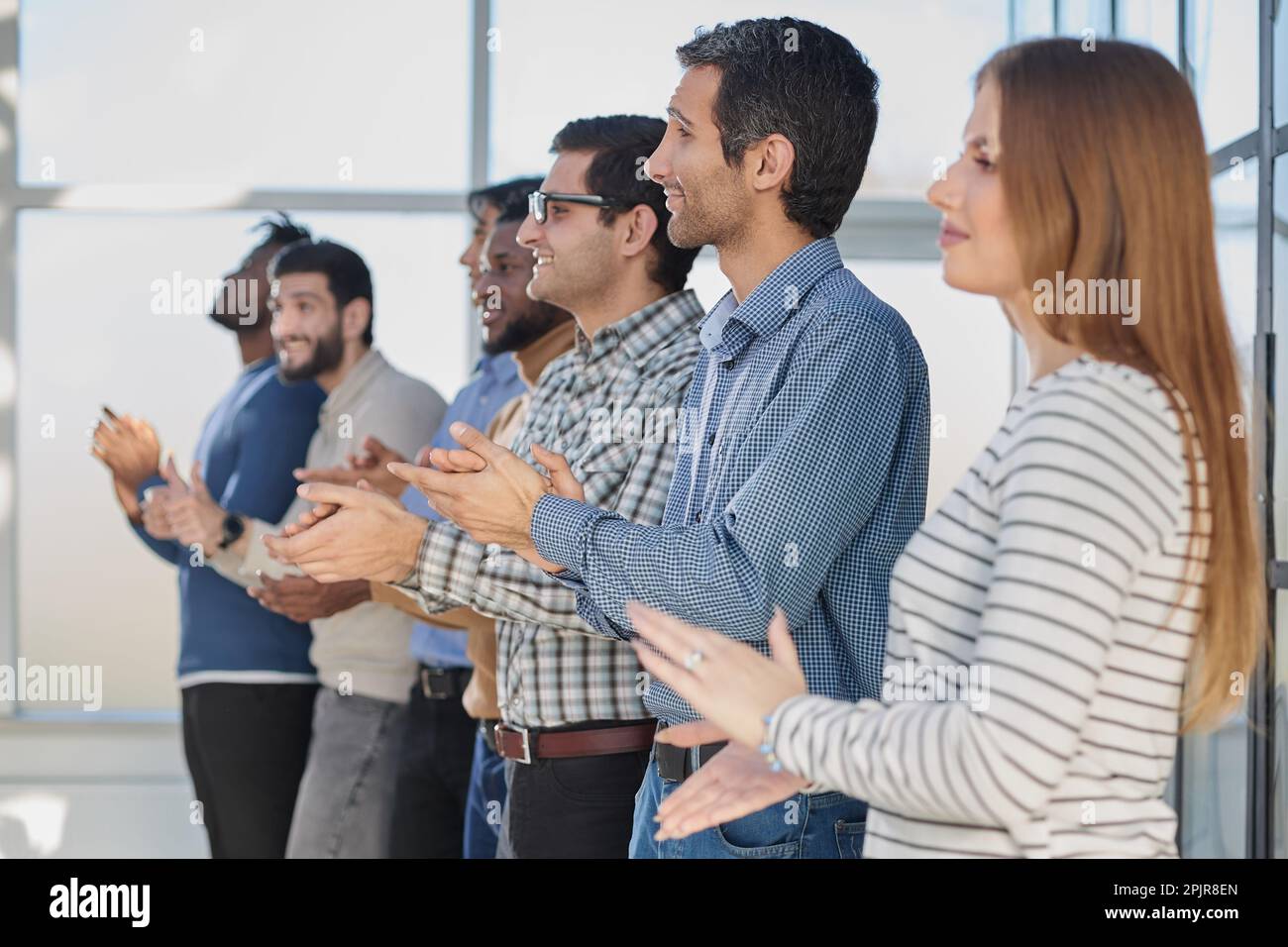 design team gave a standing ovation in the creative office Stock Photo ...