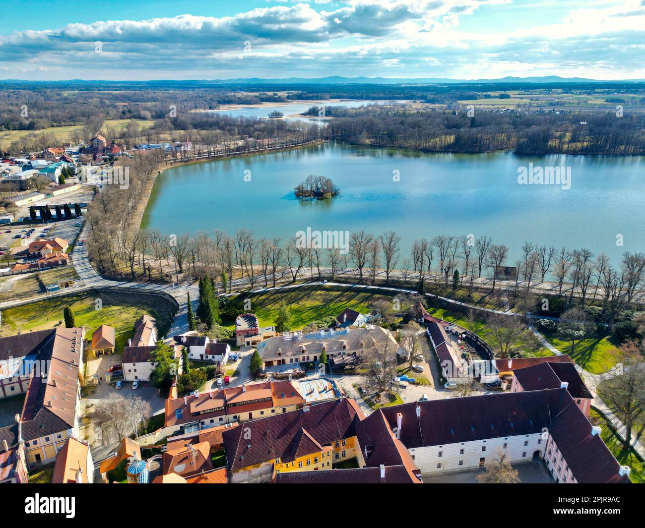 An aerial view of a bright blue lake in the city of Trebon, Czech ...