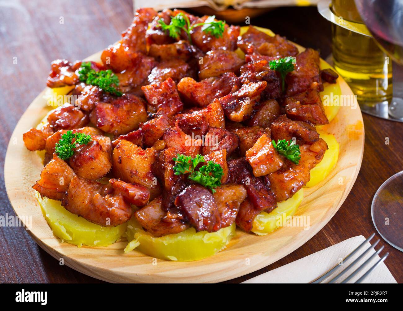 Spanish dish - roasted pig nose and cheeks Stock Photo - Alamy