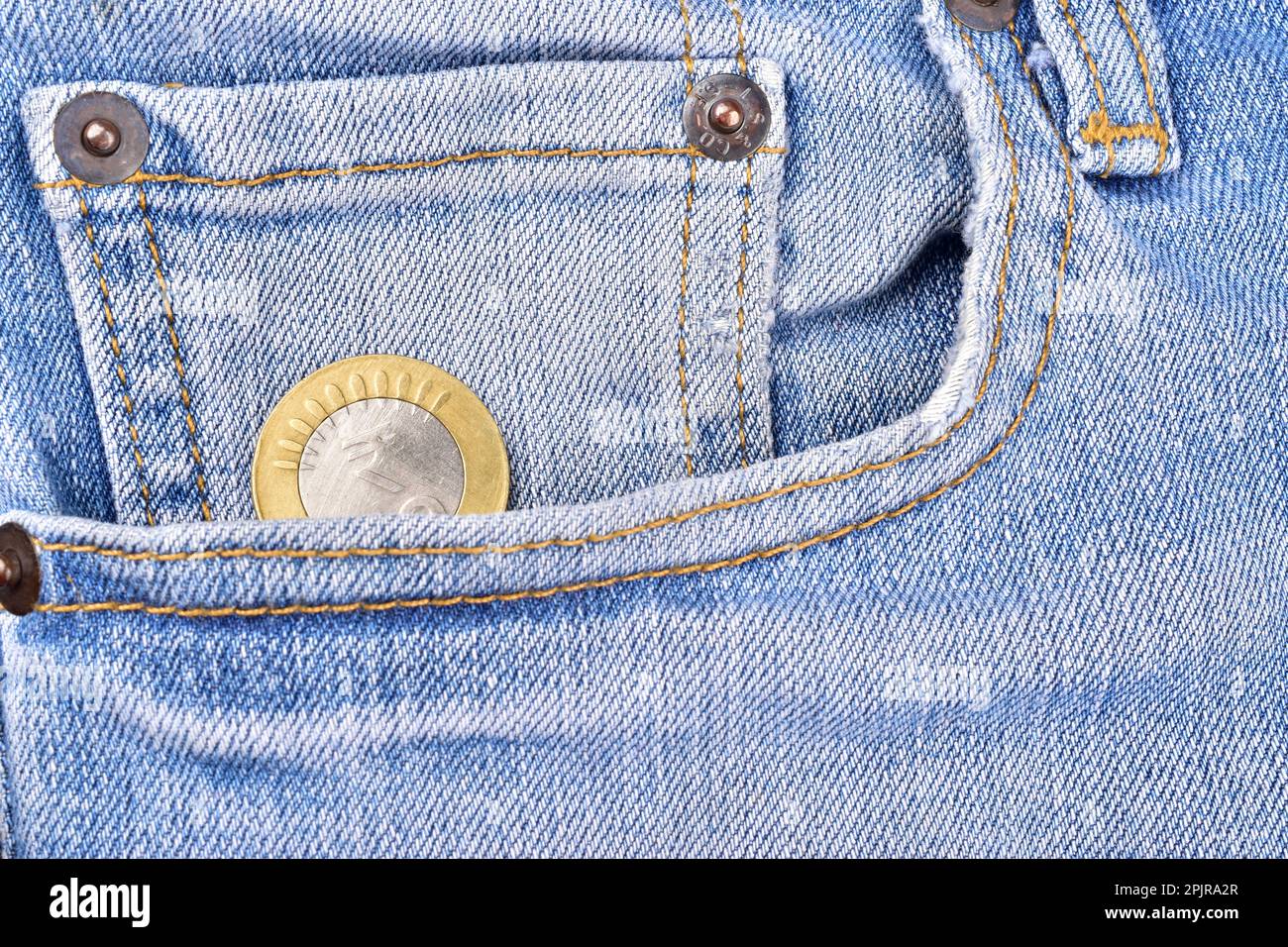 Top view of indian rupee coin in jean pocket Stock Photo - Alamy