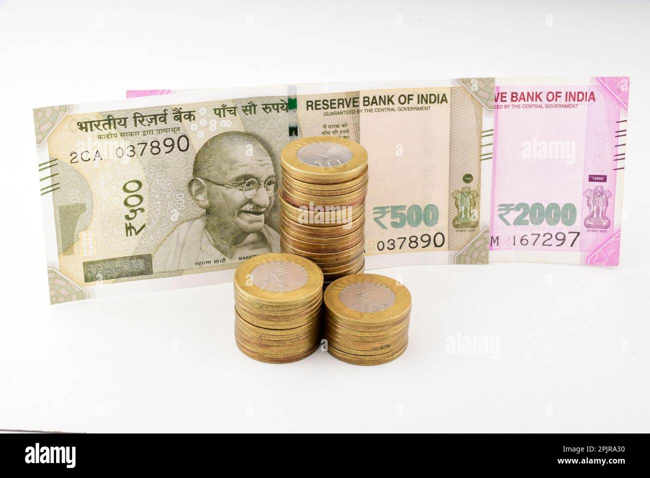 Indian currency on white background Stock Photo - Alamy