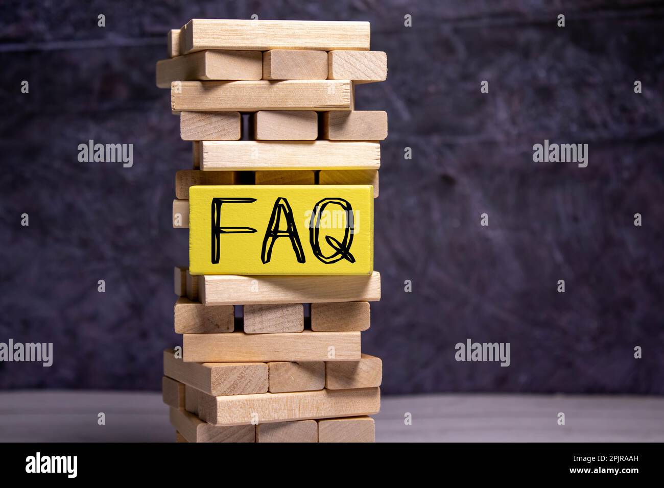 Wooden blocks with word FAQ on wooden background. Frequently asked ... Wooden blocks with word FAQ on wooden background. Frequently asked ...
