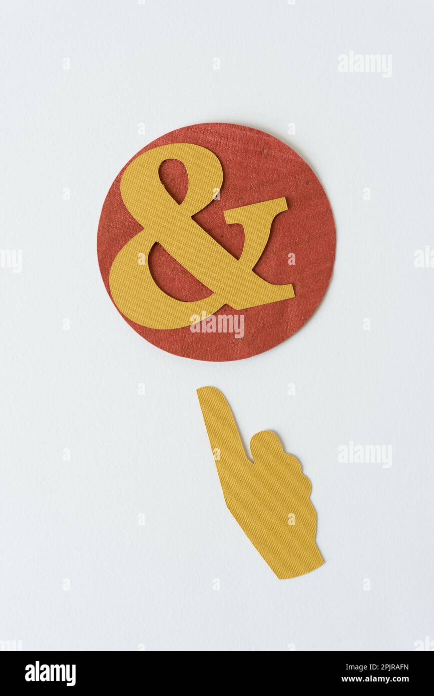 ampersand cutout on a paper circle with manicule pointing up Stock ...