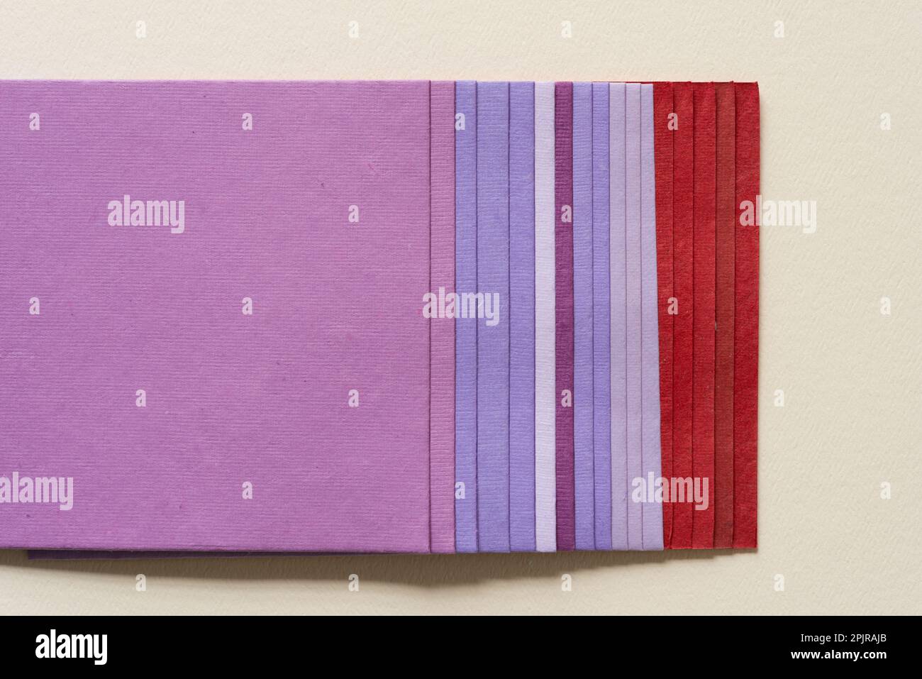 stack of variously coloured crafting paper sheets arranged on blank ...