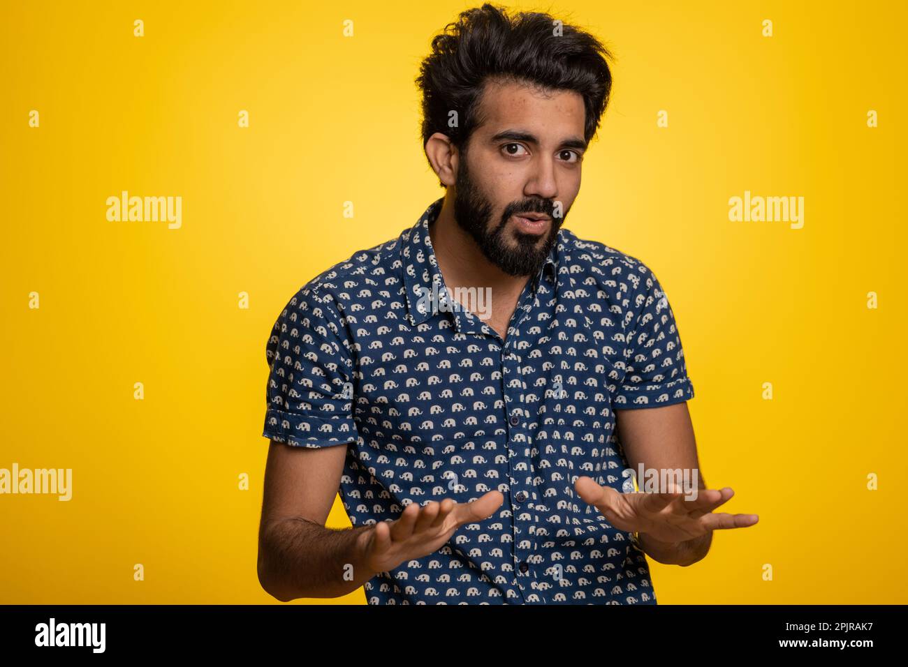 Hey you, be careful. Indian man warning with admonishing finger gesture ...