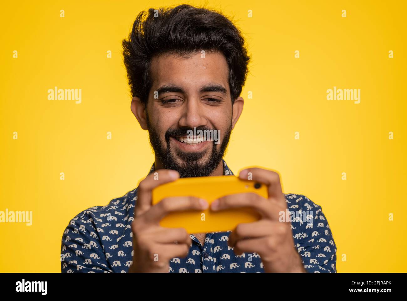 Addicted young indian man enthusiastically hi-res stock photography and ...