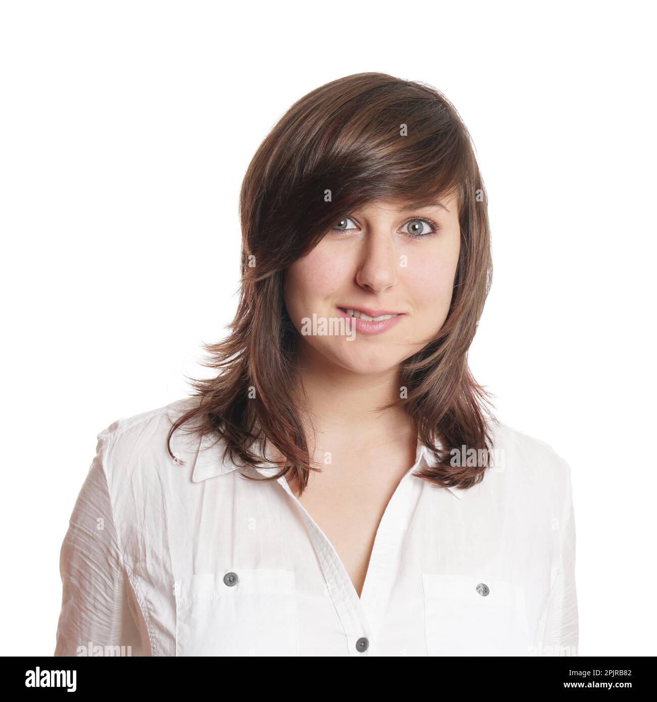 brunette young woman with neutral but friendly expression isolated on ...