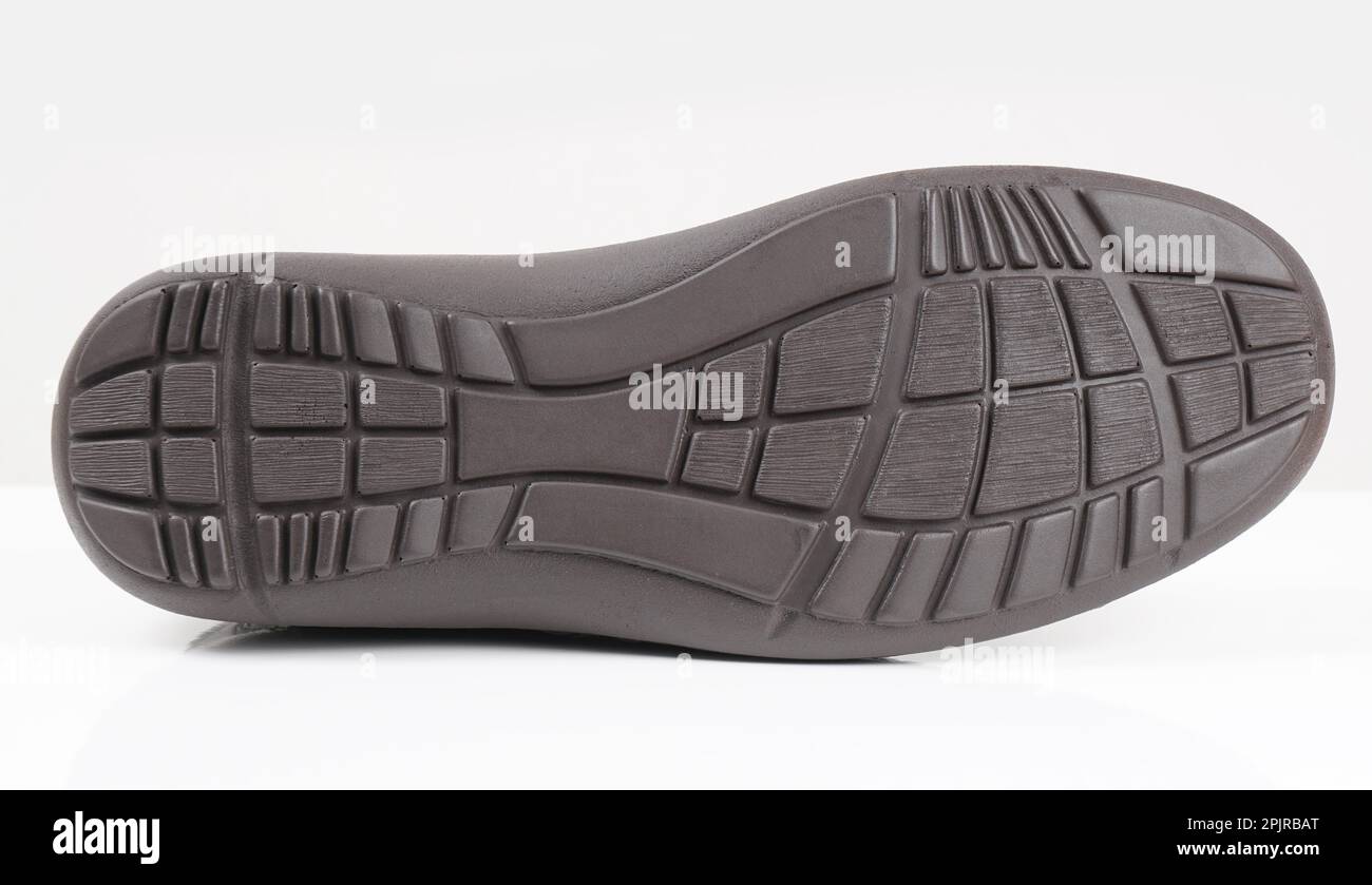 Rubber sole of a mens shoe on white background Stock Photo - Alamy