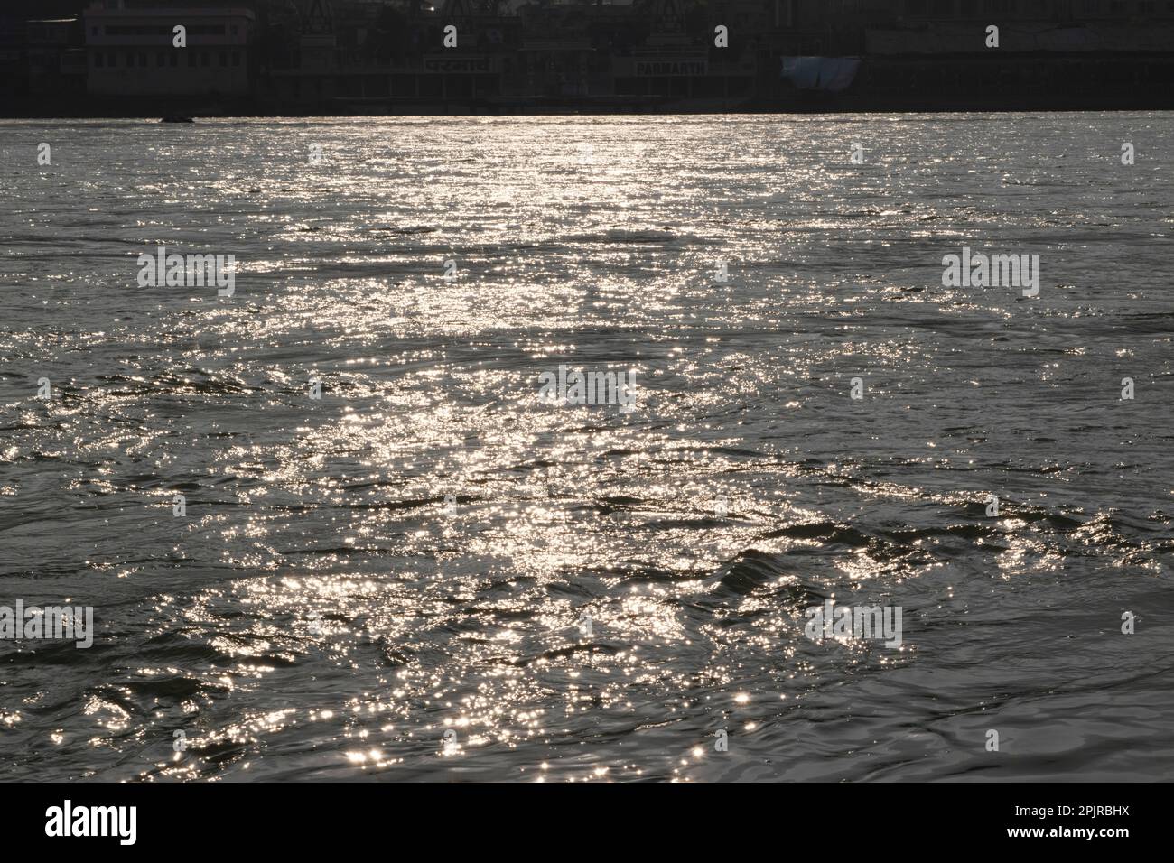 Sunlight reflection on river water Stock Photo - Alamy