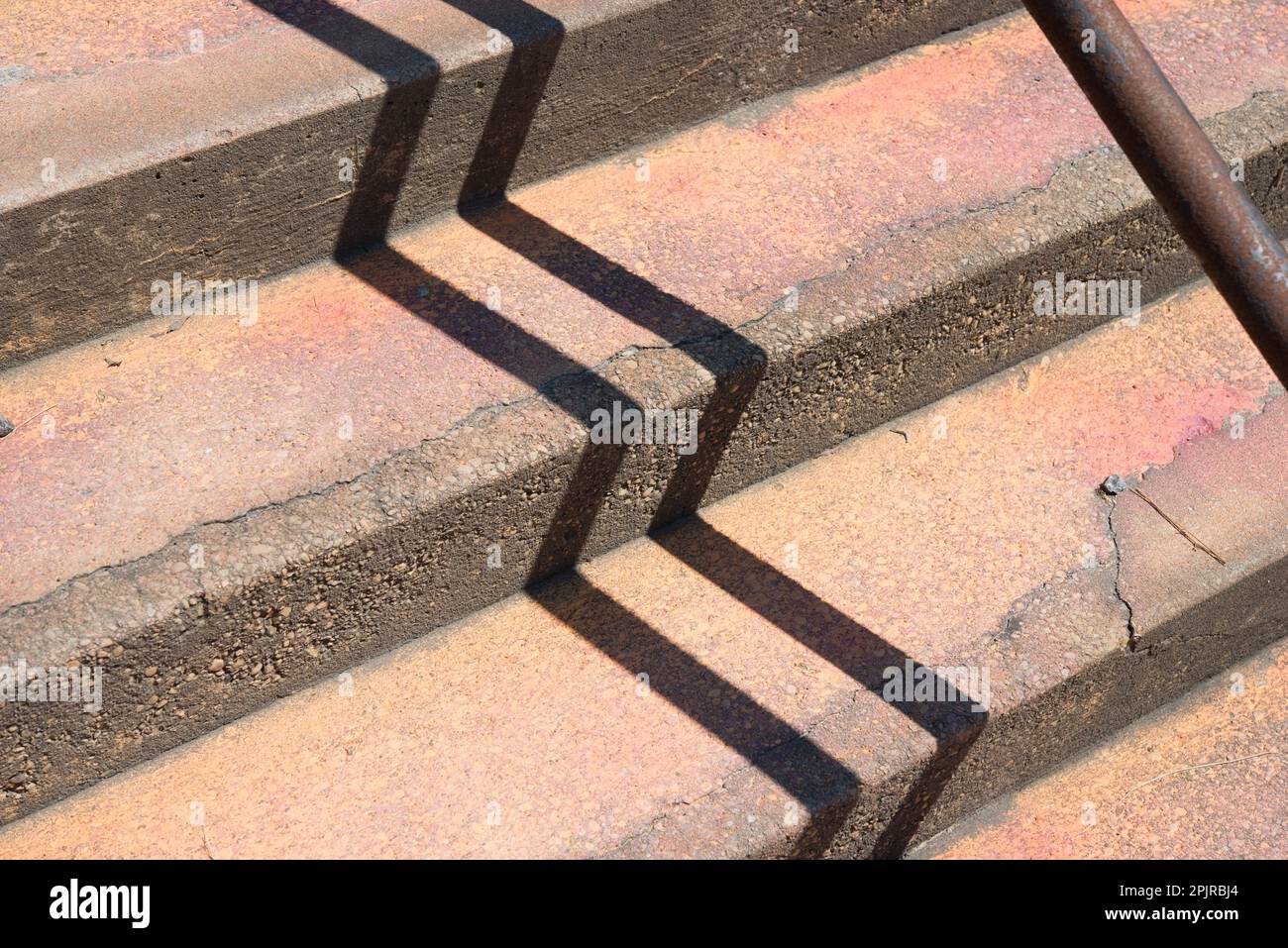 old concrete steps and metal railing with zig zag shadow Stock Photo ...