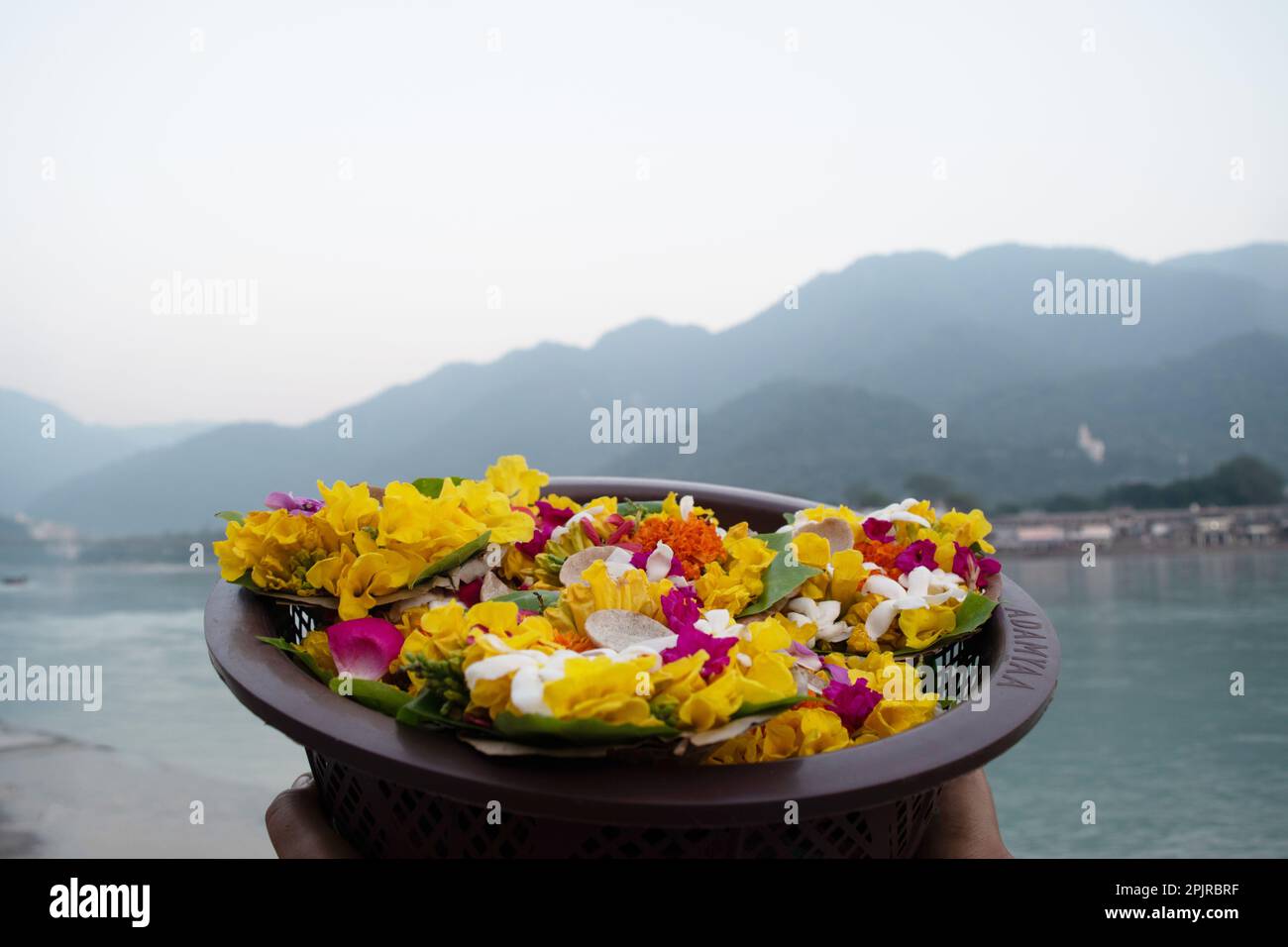 Flower basket for pooja at ganga ghat rishikesh Stock Photo - Alamy