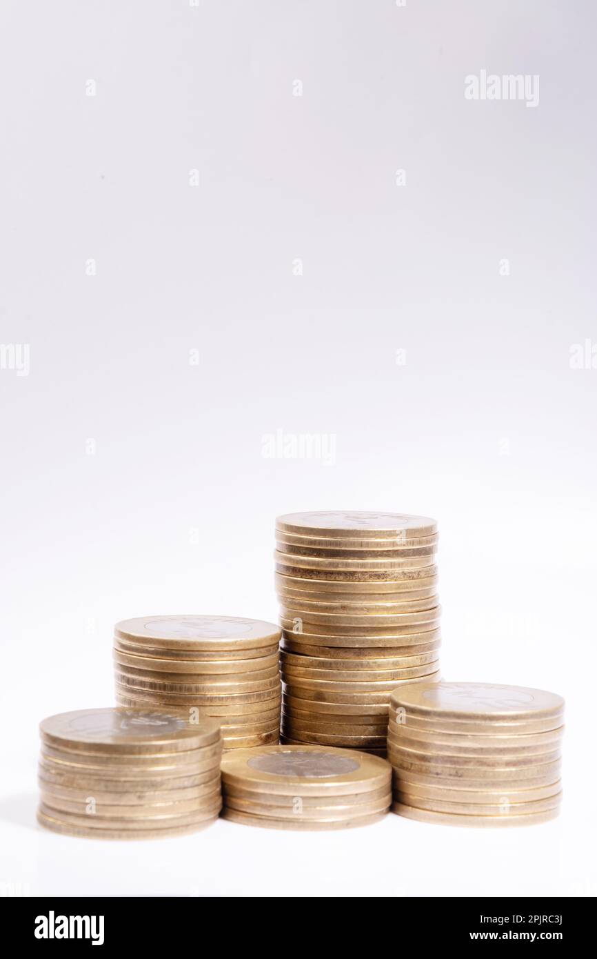 Coin stack isolated on white background Stock Photo - Alamy