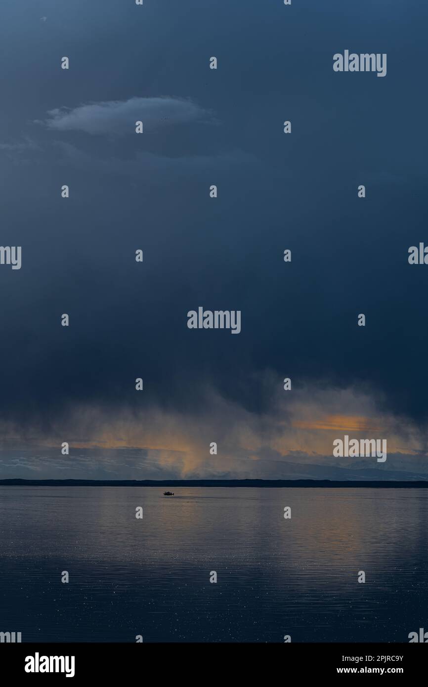 Rain Cloud and Fishing Boat on Potholes Reservoir close to Moses Lake ...